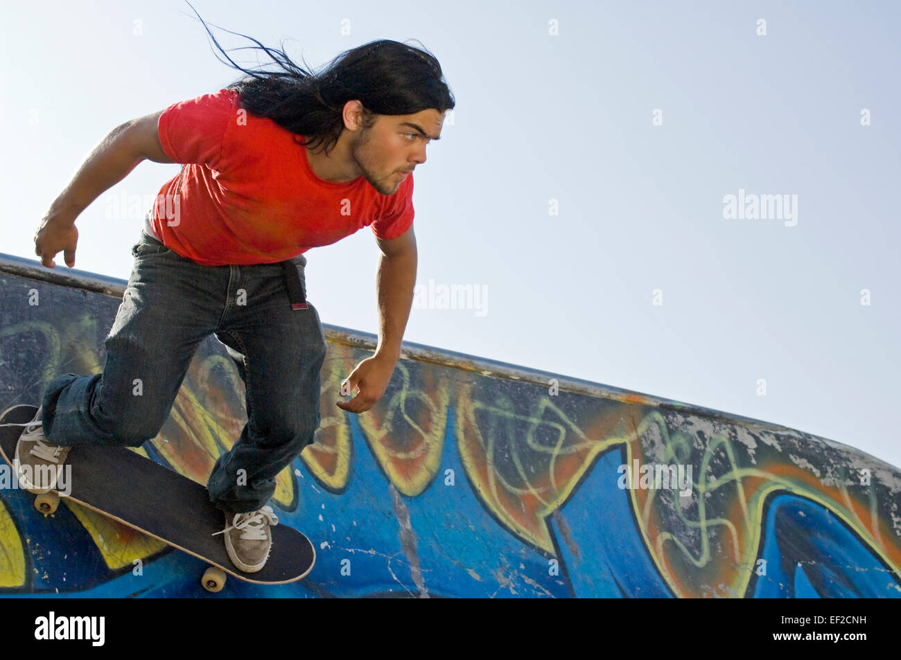 A young man skateboarding on a skateboard ramp Stock Photo - Alamy