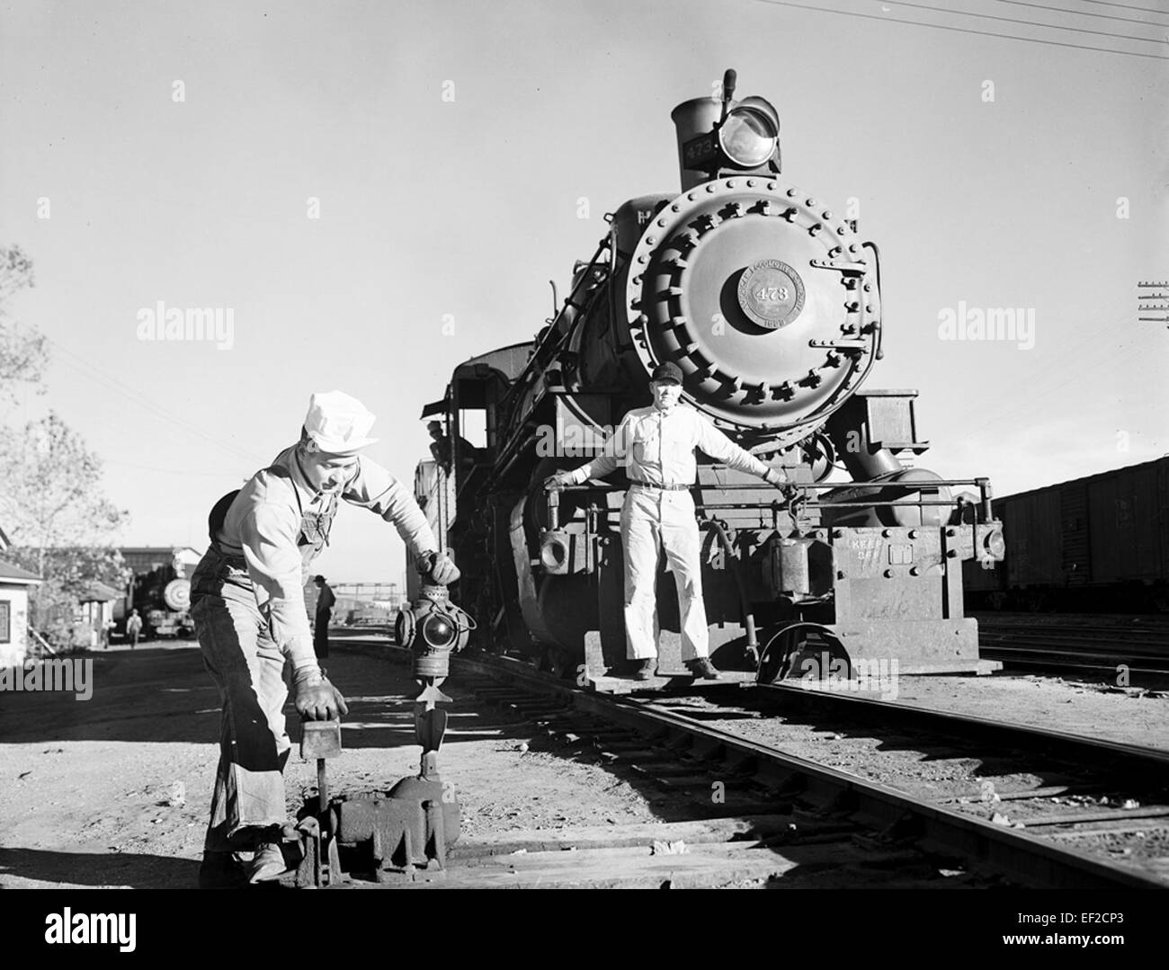 This image shows Locomotive 473, with a brakeman operating the signal ...