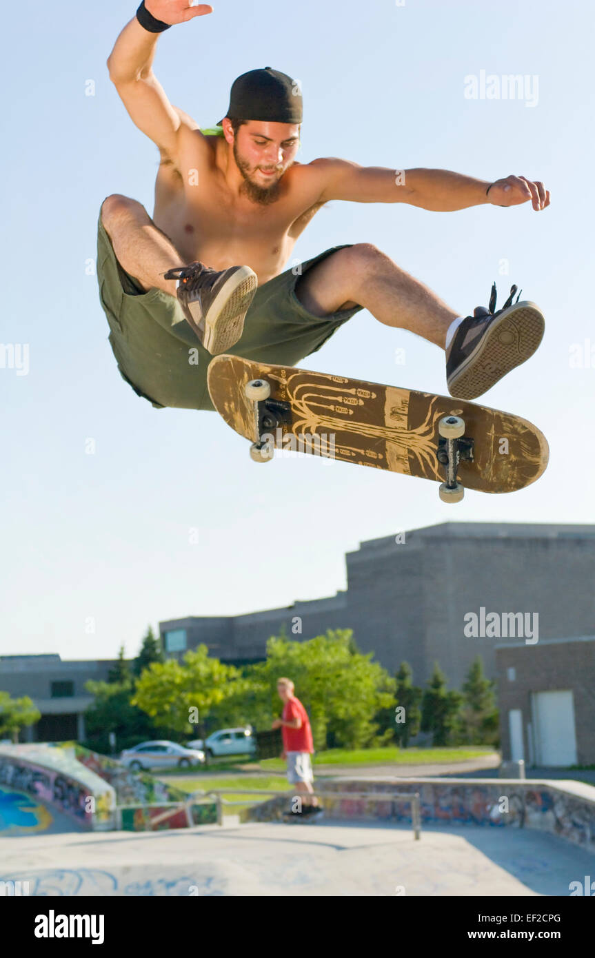 A young man skateboarding on a ramp Stock Photo - Alamy
