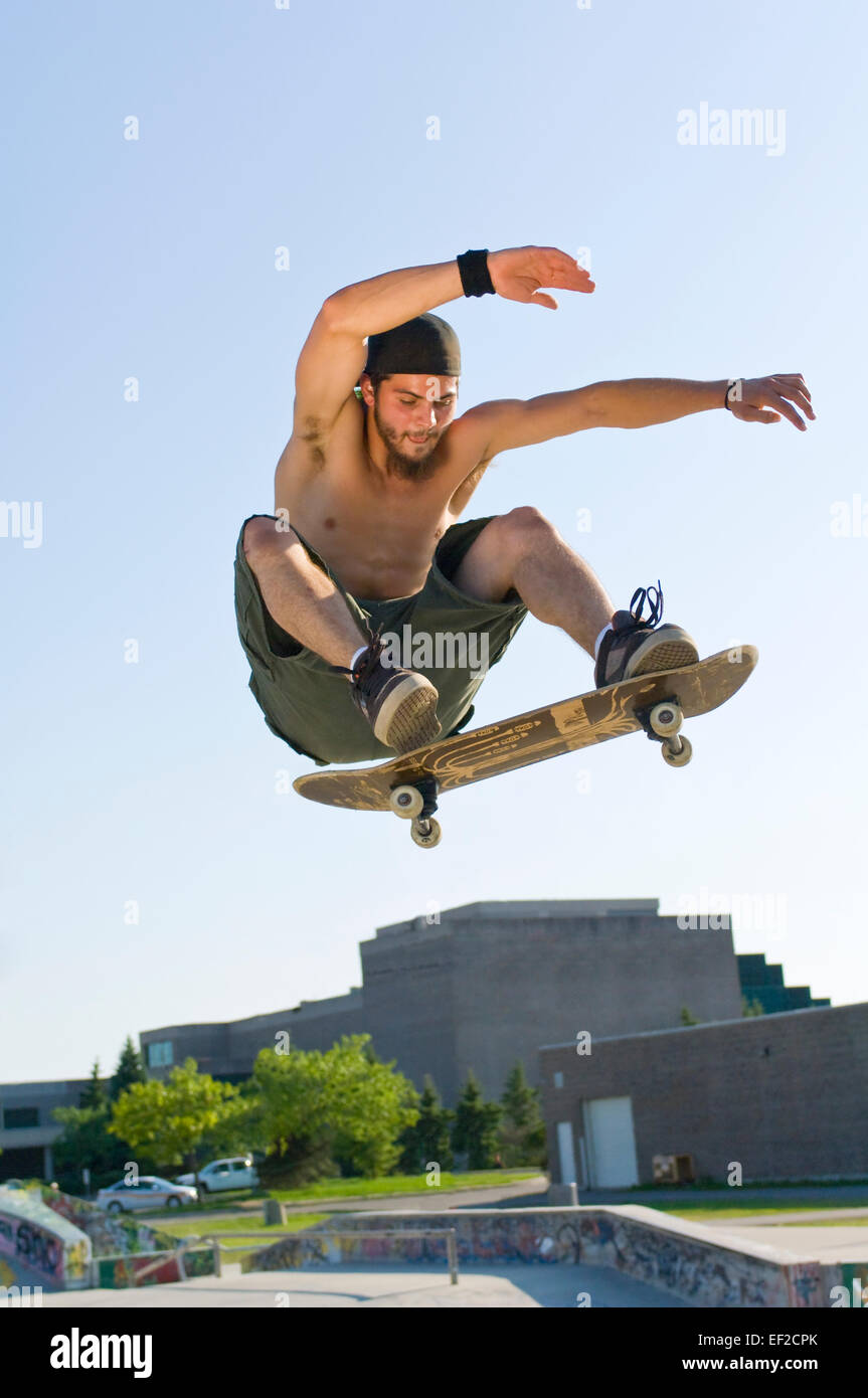 A young man skateboarding on a ramp Stock Photo - Alamy