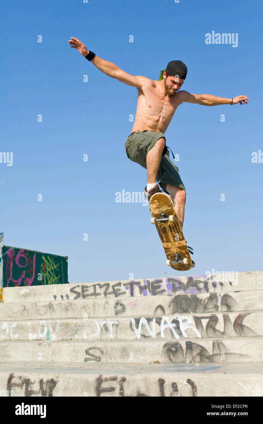 A young man skateboarding on a ramp Stock Photo - Alamy