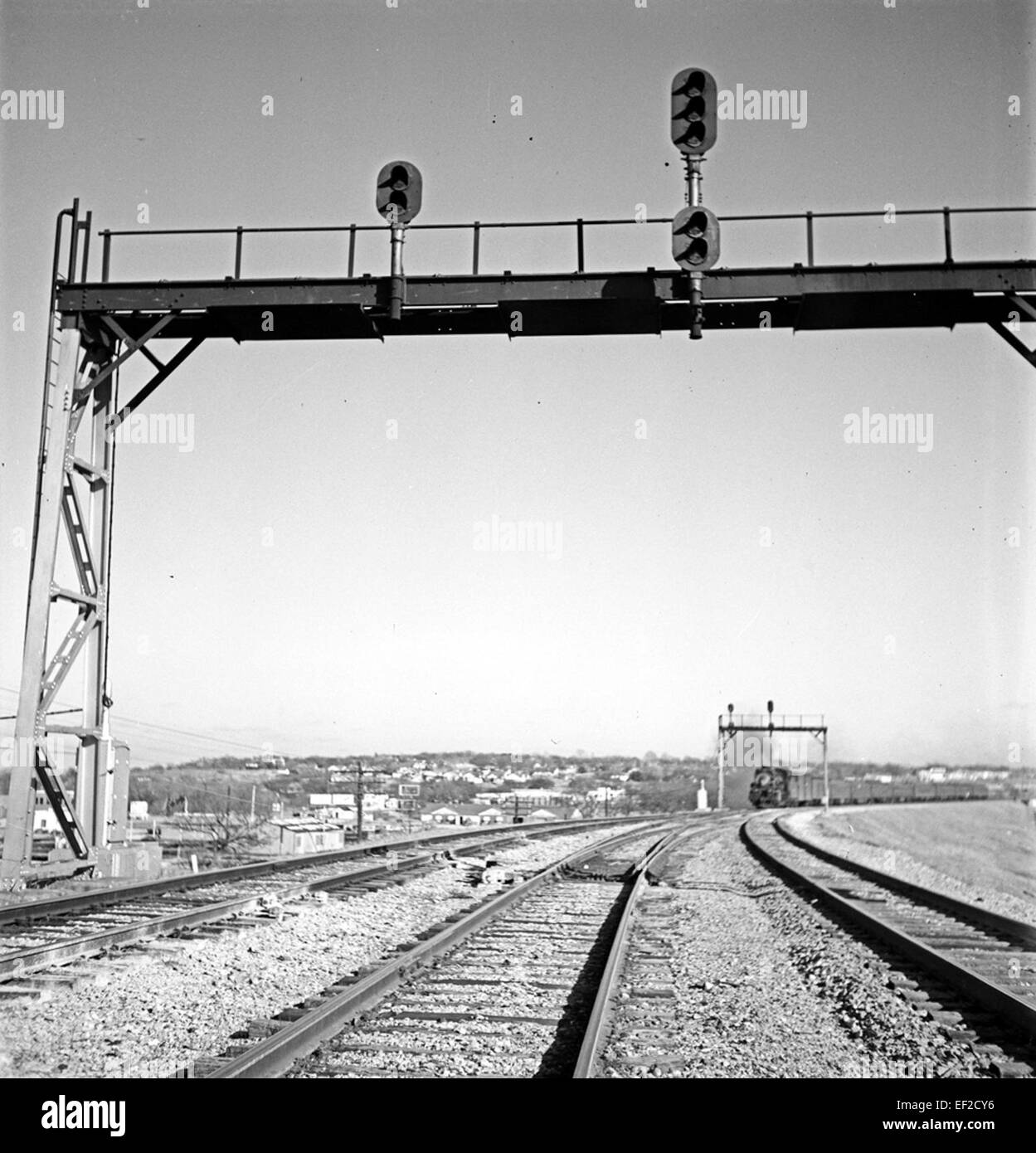 This image shows Locomotive 780 approaching a signal bridge on the ...