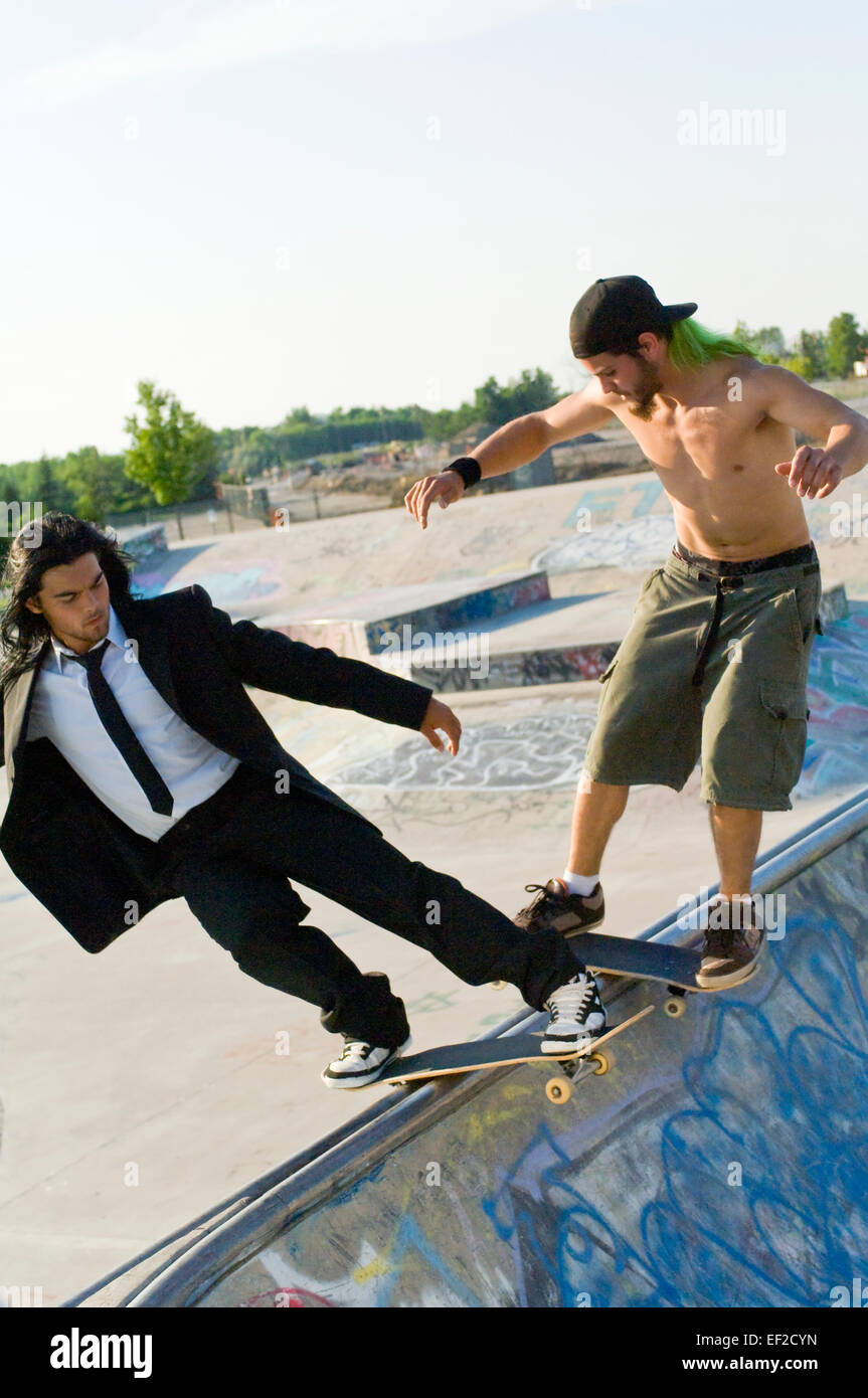 Two young men skateboarding on a ramp Stock Photo - Alamy