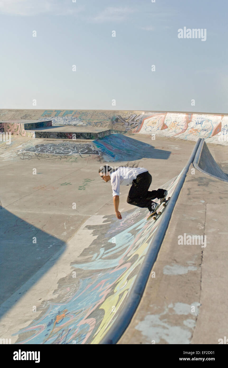 A young man skateboarding on a ramp Stock Photo - Alamy