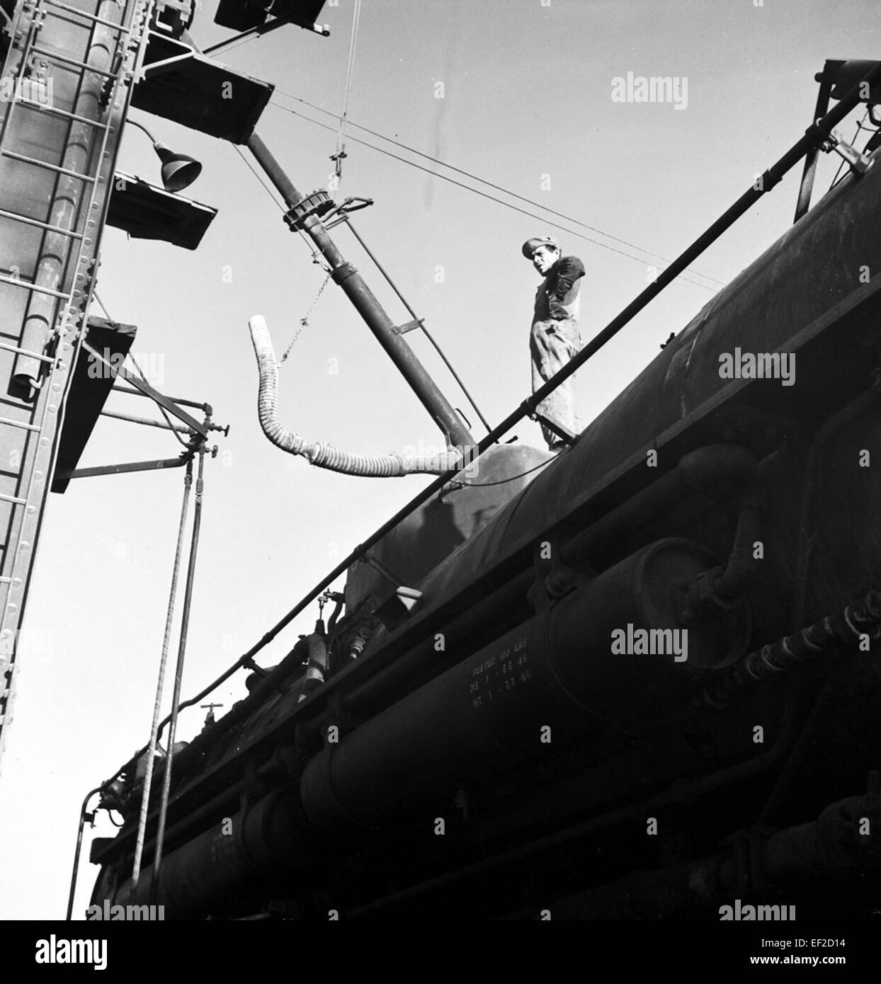 A historical image showing workers refilling the sand dome of a ...
