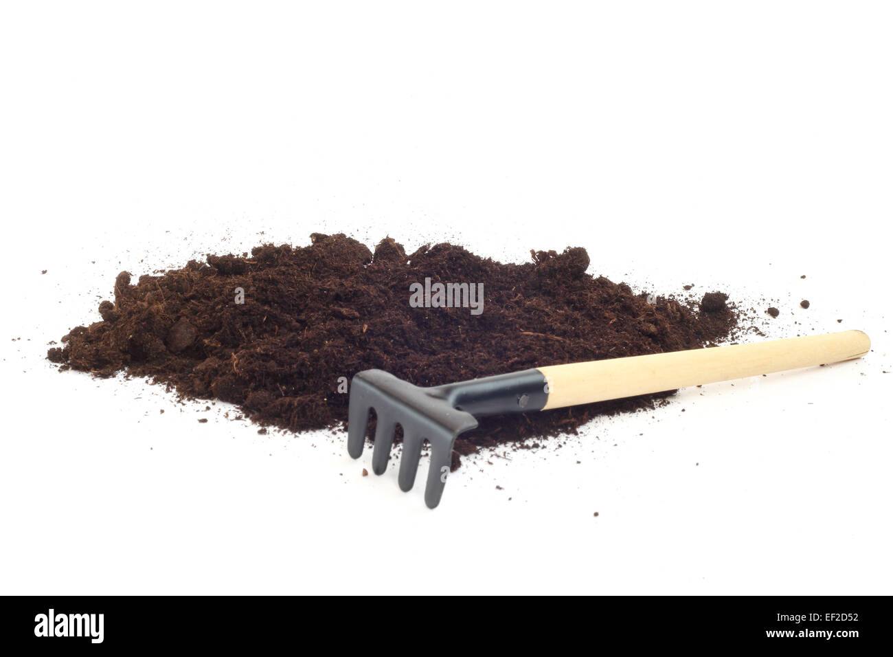 Rake and dirt isolated on white background, gardening concept Stock ...