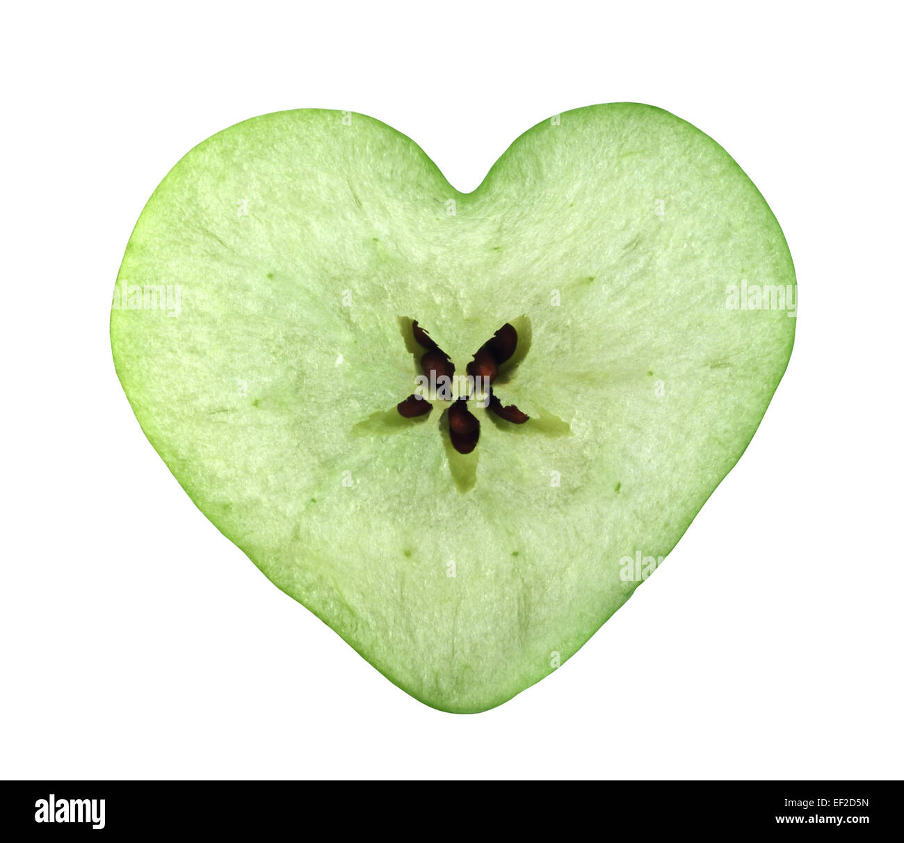 Green apple cross section shaped like heart on white background Stock ...