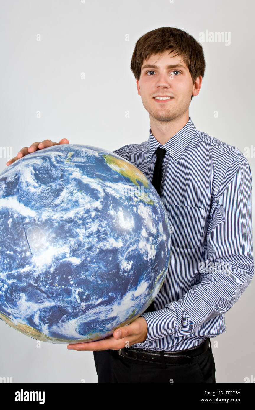 Man holding a globe Stock Photo - Alamy
