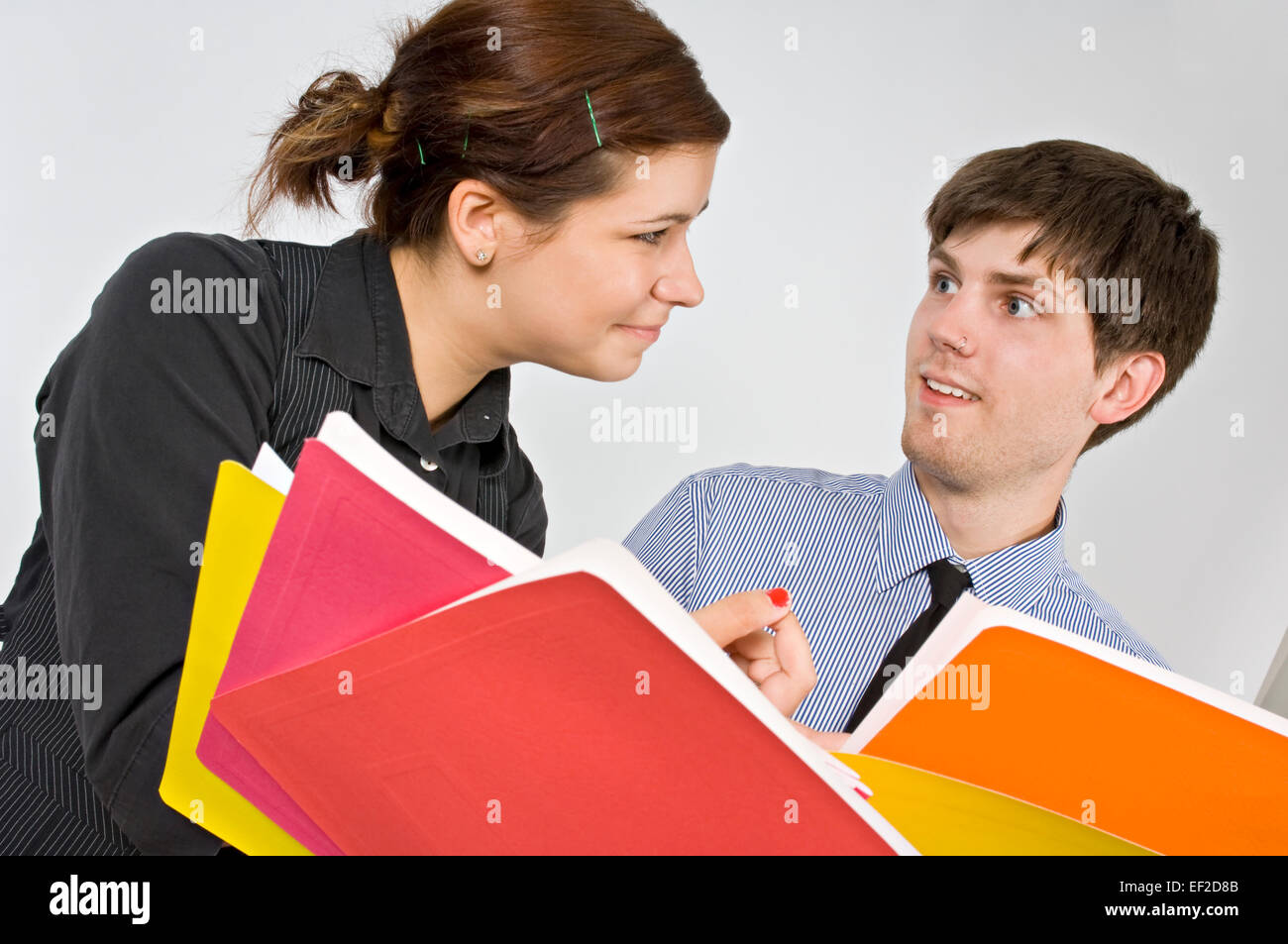 Couple looking at paperwork Stock Photo - Alamy