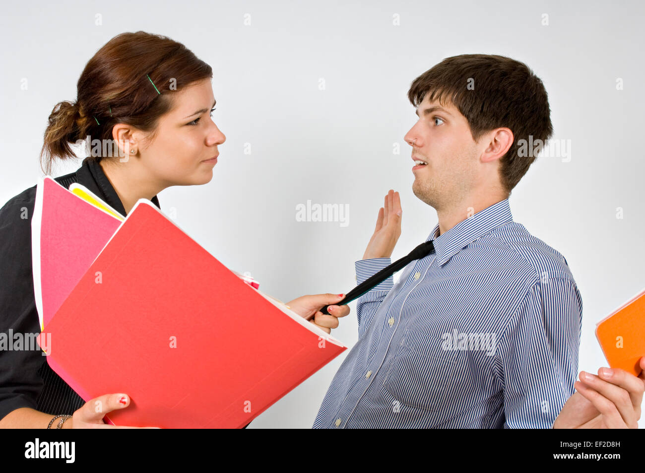 Woman pulling man's tie hi-res stock photography and images - Alamy