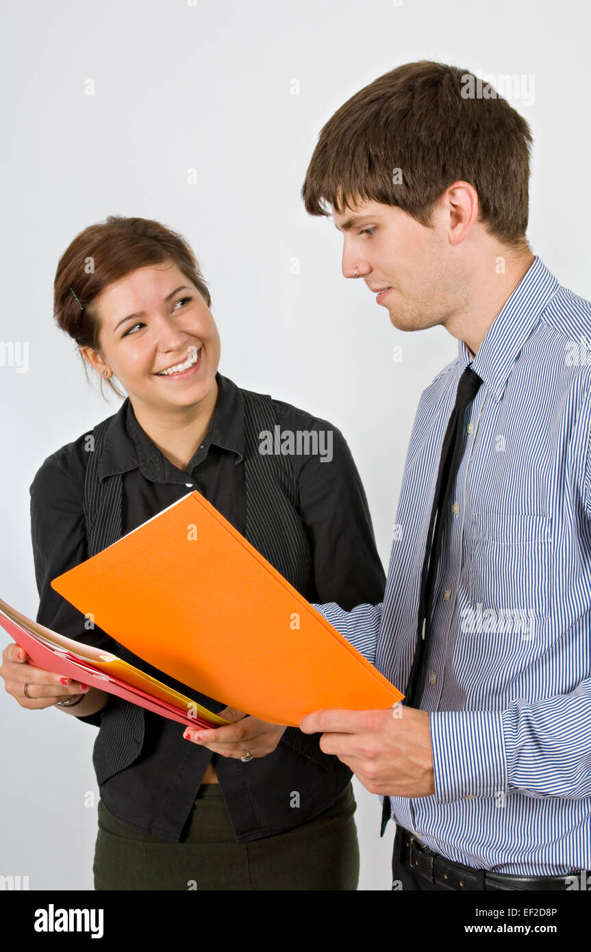 Couple looking at paperwork Stock Photo - Alamy