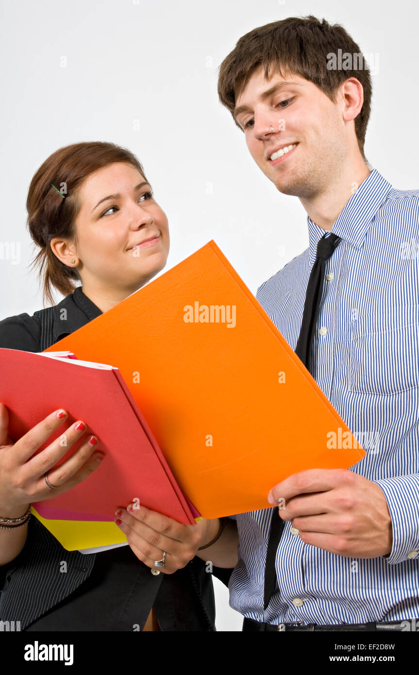 Couple looking at paperwork Stock Photo - Alamy