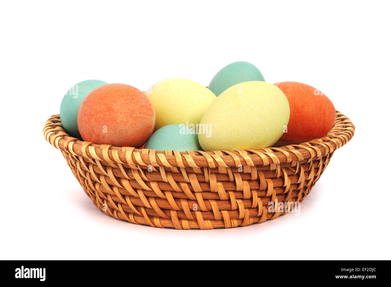Colorful easter eggs in basket isolated on white Stock Photo - Alamy