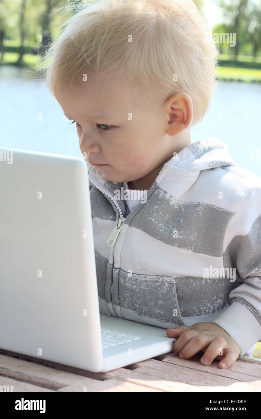 Girl in the field with laptop hi-res stock photography and images - Alamy