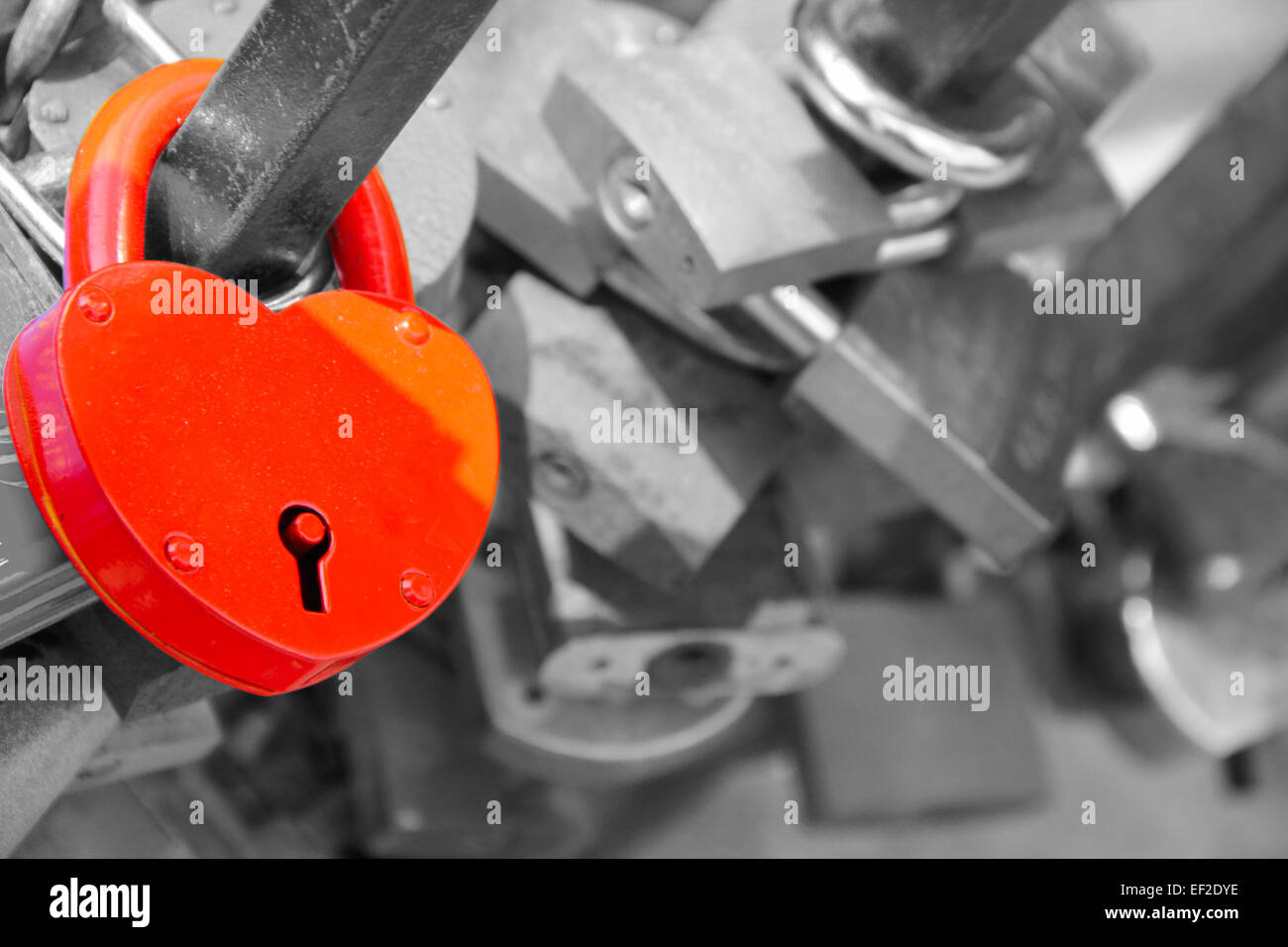 Many marriage love symbol padlocks chained on bridge Stock Photo - Alamy