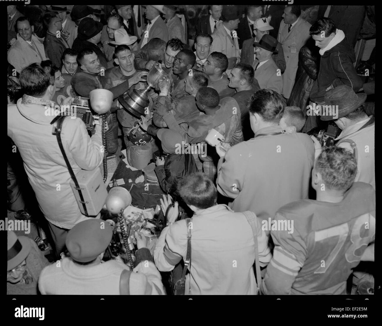 A football team is shown celebrating their victory, capturing the ...