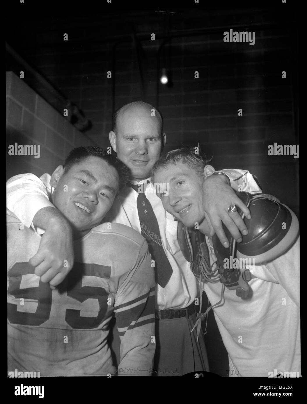 Two football players, captured in action, display their athleticism on ...