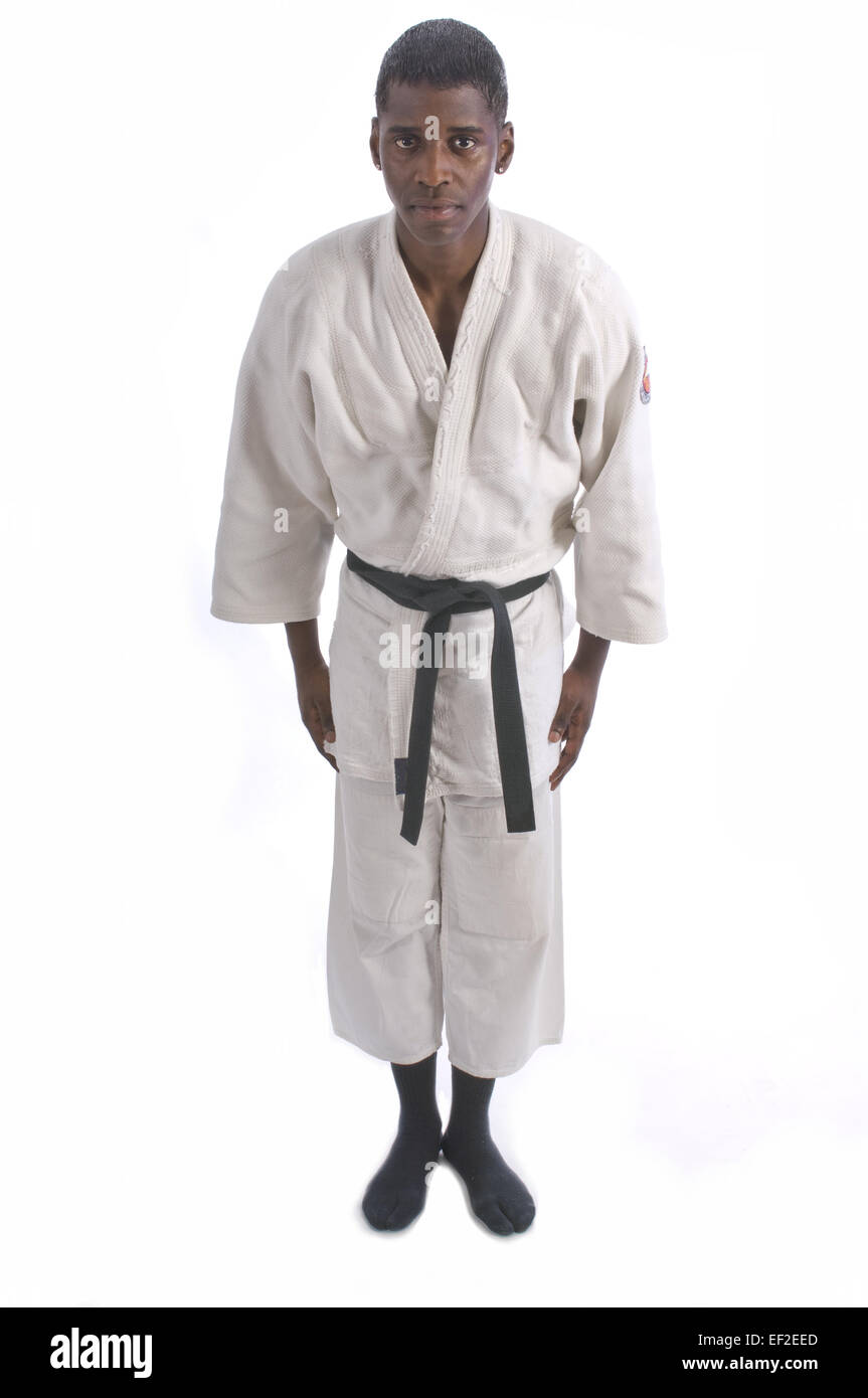 Young man wearing a karategi practicing karate Stock Photo - Alamy