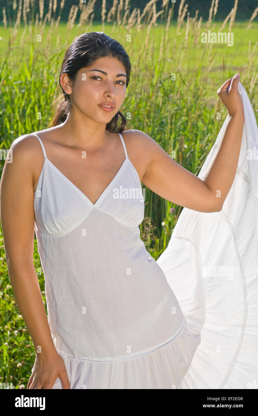 Standing woman facing grass hi-res stock photography and images - Alamy