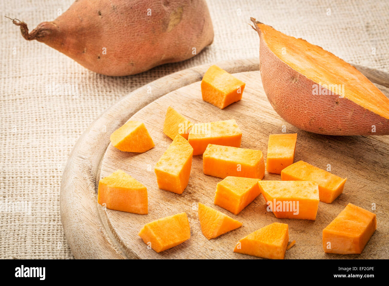 sweet potato cut and diced on a cutting board Stock Photo - Alamy