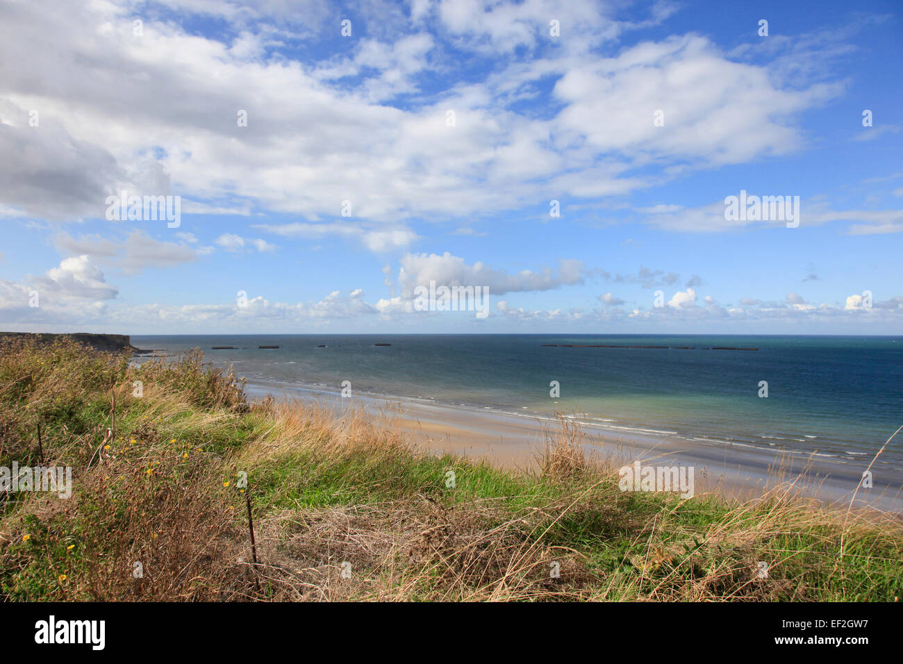 Sandy beach Arromanche Normandy France with Mulberry harbor ruins Stock ...
