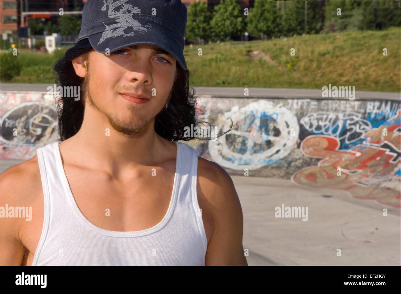 Skateboarder hanging around at a skate park Stock Photo - Alamy