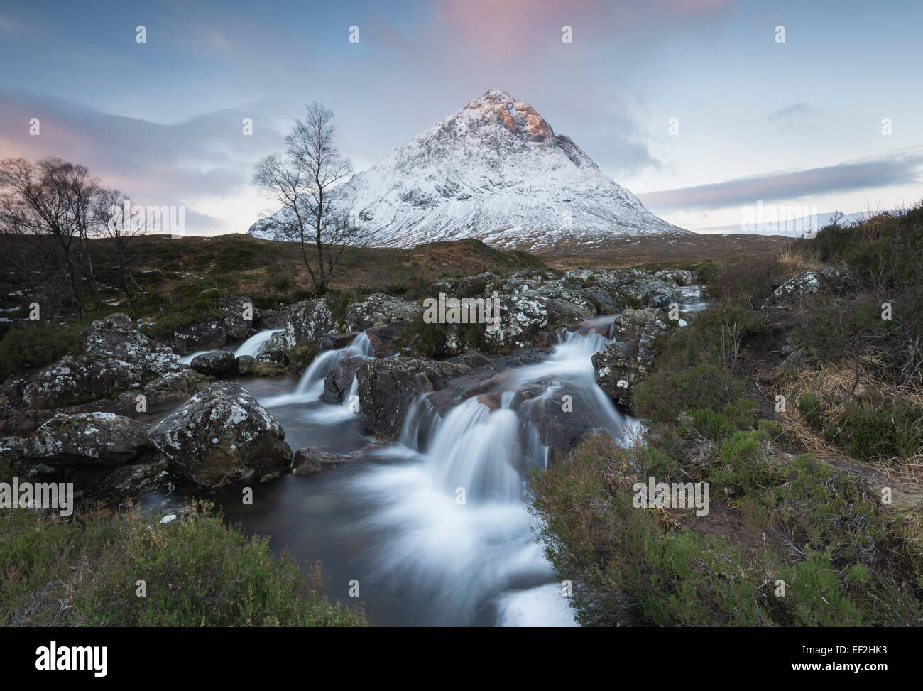 Snow dusted Stob Dearg, Buachaille Etive Mor, and waterfalls on the ...
