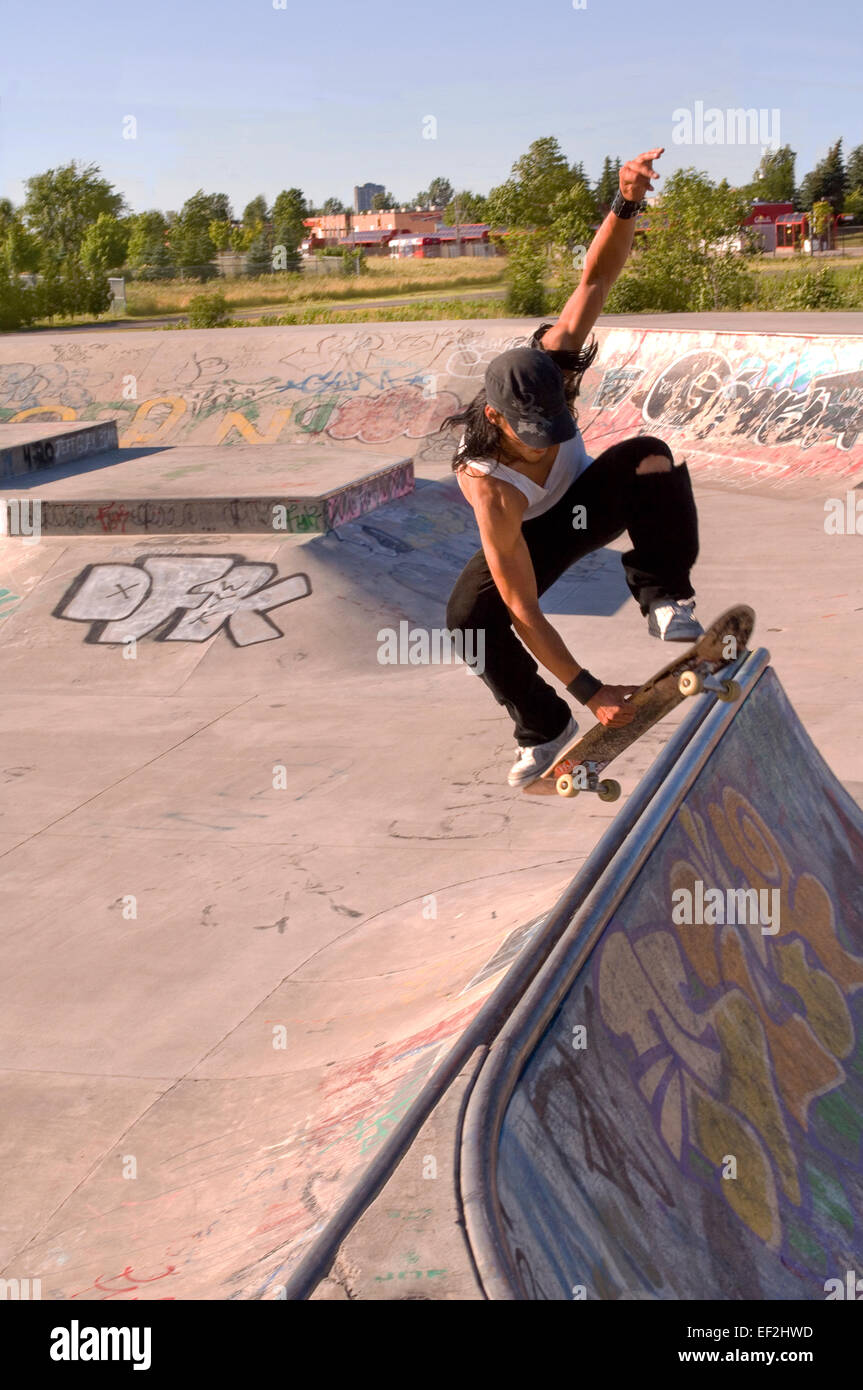 Skateboarder doing an aerial at a skate park Stock Photo - Alamy