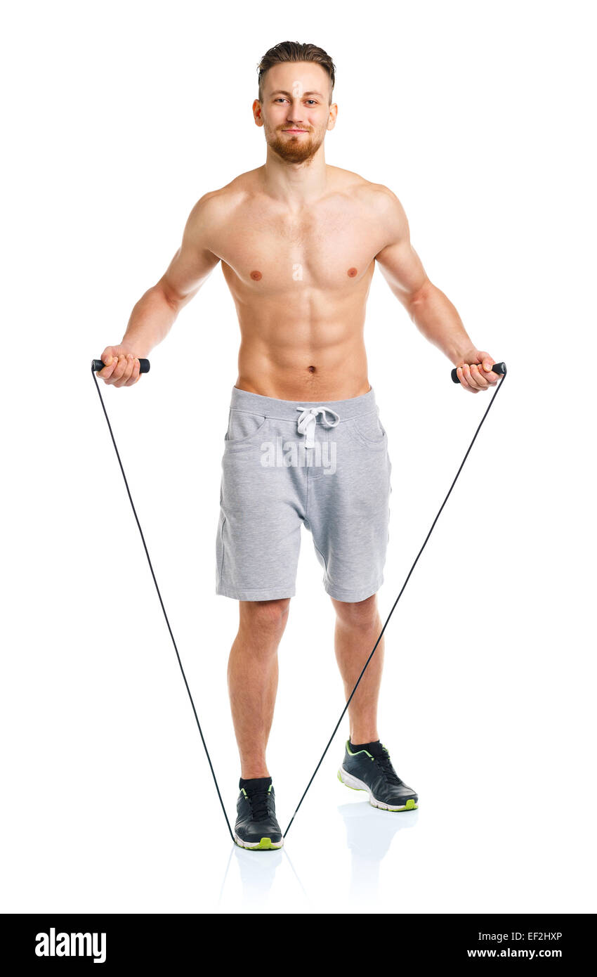 Athletic attractive man jumping on a rope on the white background Stock ...
