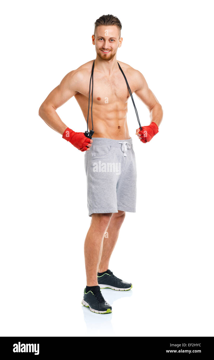Athletic attractive man jumping on a rope on the white background Stock ...