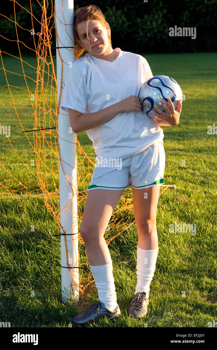 Girl on a soccer field Stock Photo - Alamy