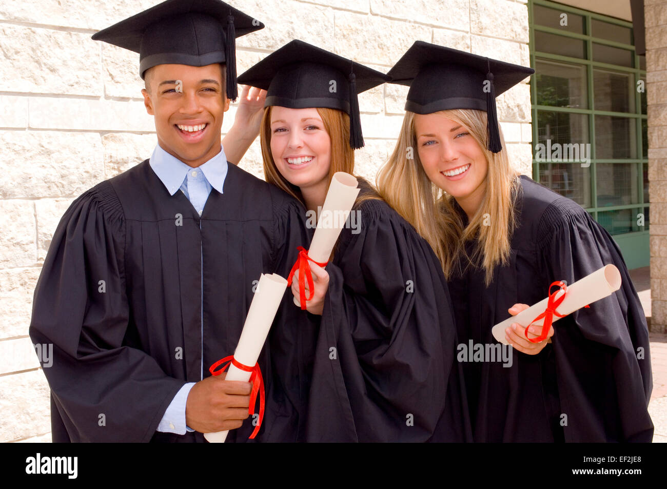 Three friends at graduation ceremony Stock Photo - Alamy