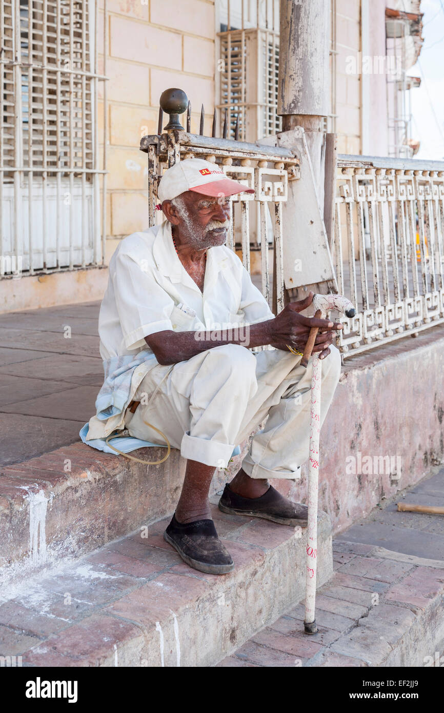 Friendly but infirm local old man dressed in white clothing with a ...