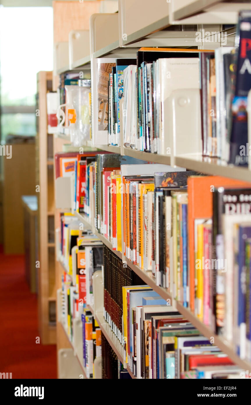 A bookshelf in a library Stock Photo - Alamy