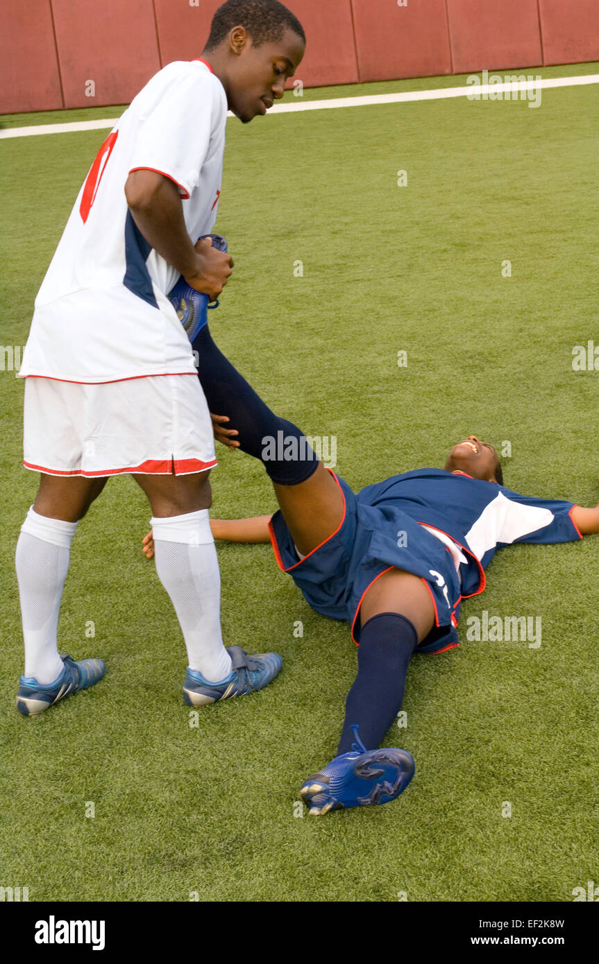 Injured soccer player on field Stock Photo - Alamy