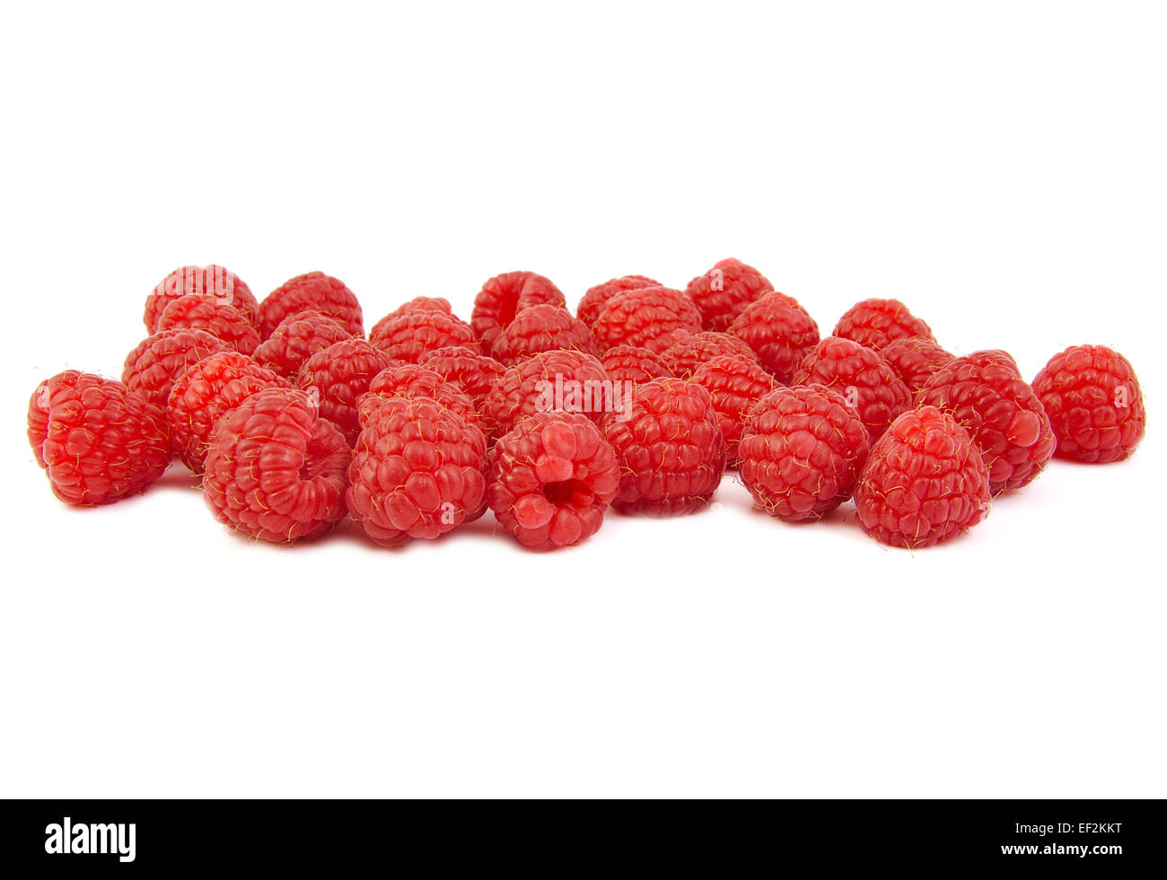 Bunch of raspberries on a white background Stock Photo - Alamy