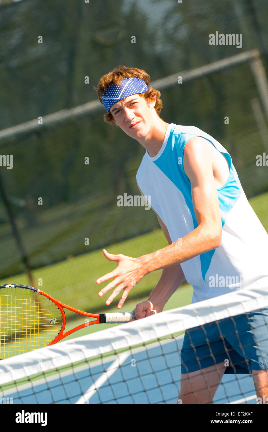 Tennis player alone on a court Stock Photo - Alamy