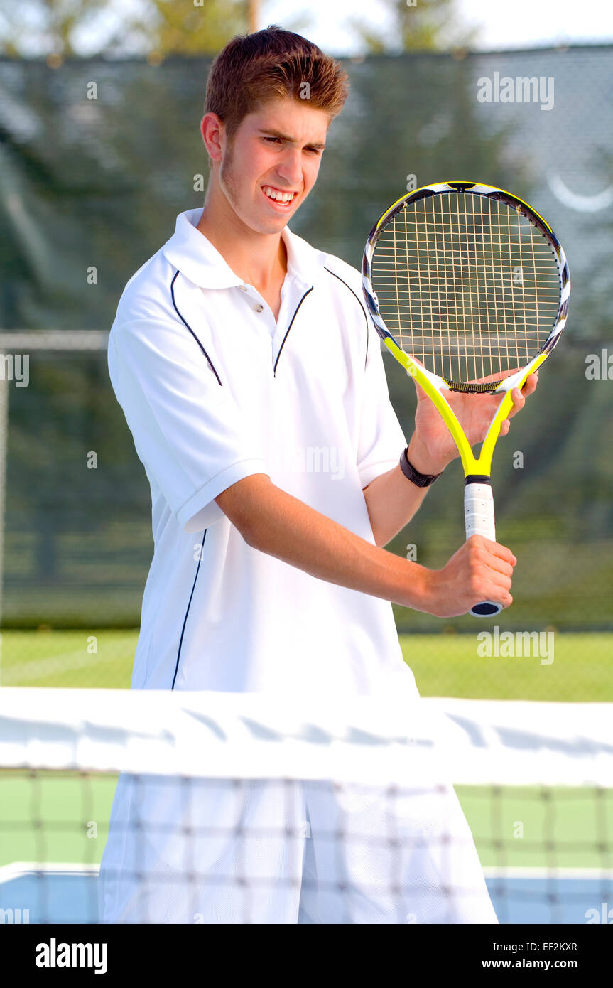 Tennis player alone on a court Stock Photo - Alamy
