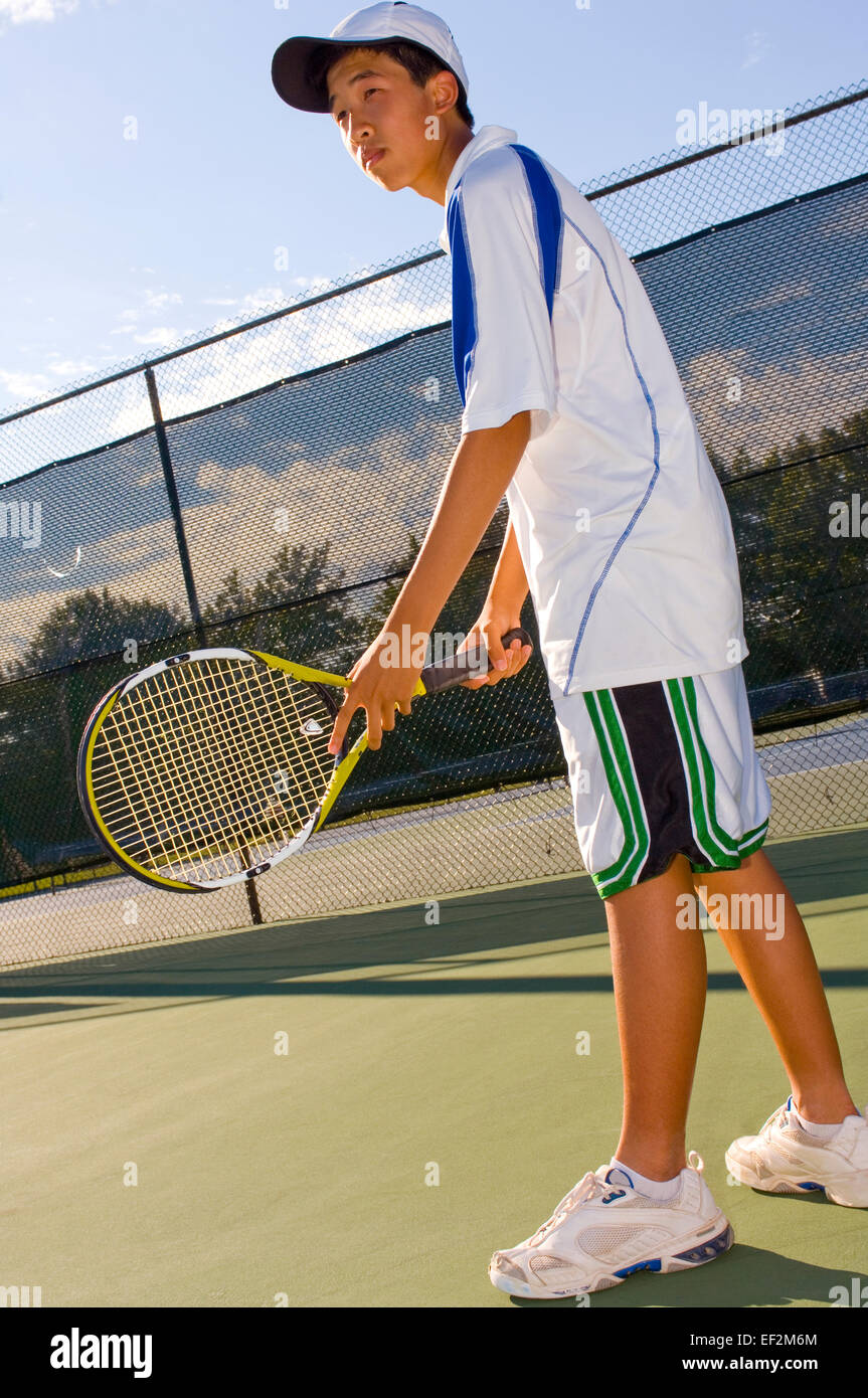 Tennis player alone on a court Stock Photo - Alamy