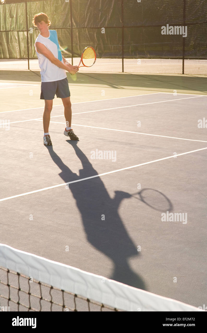 Tennis player alone on a court Stock Photo - Alamy