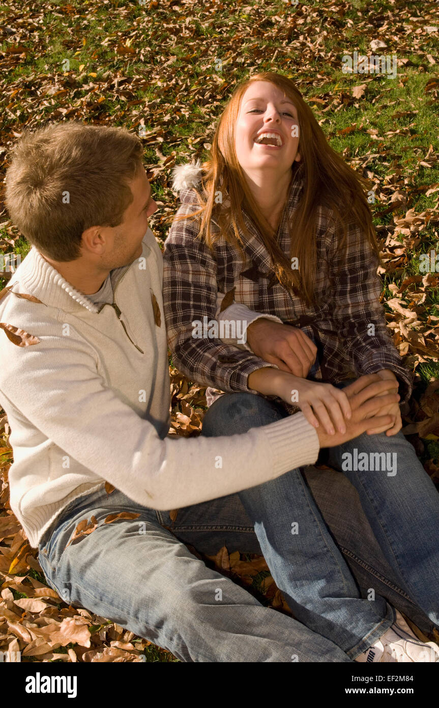 Couple being affectionate in a park Stock Photo - Alamy