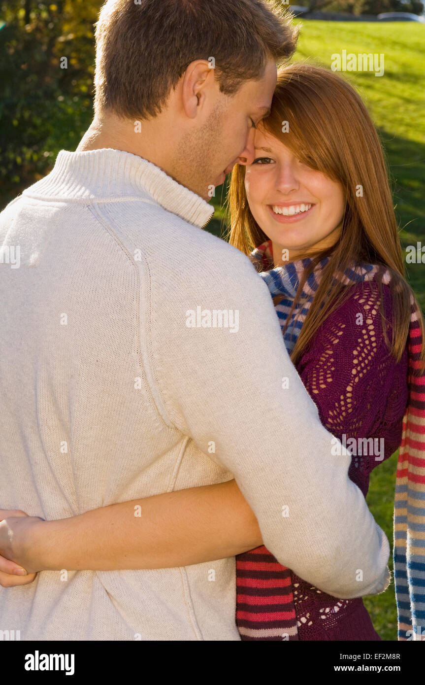 Couple being affectionate in a park Stock Photo - Alamy
