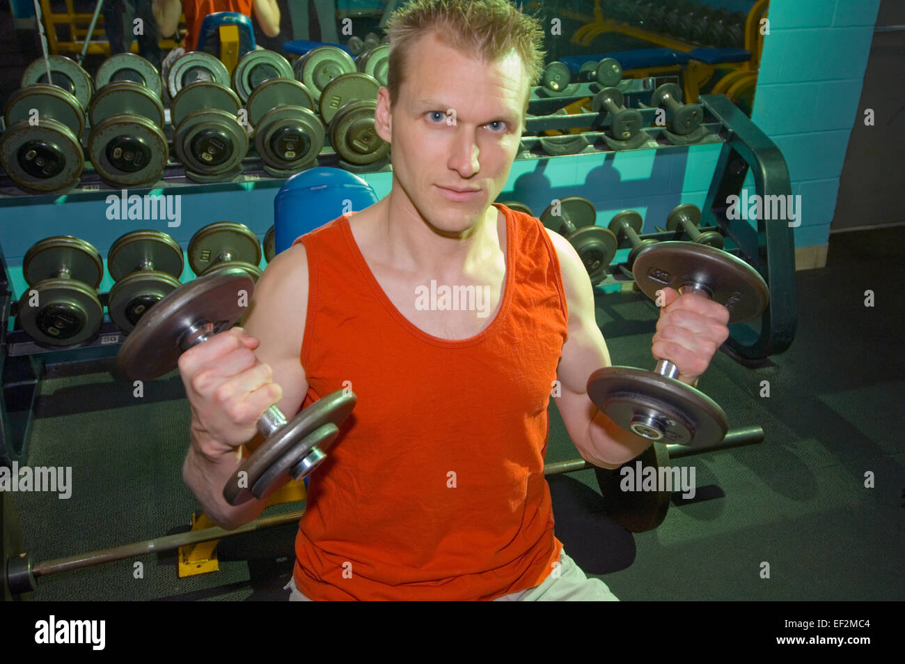 Man working out with weights Stock Photo - Alamy