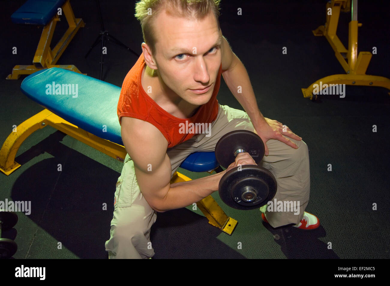 Man working out with weights Stock Photo - Alamy