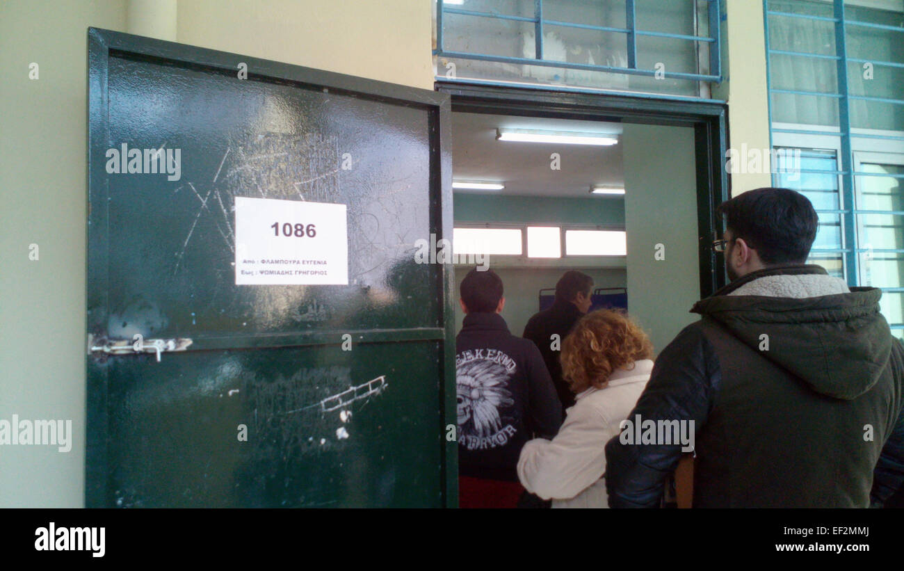 Greek voters wait outside a voting center in Athens. People all over ...