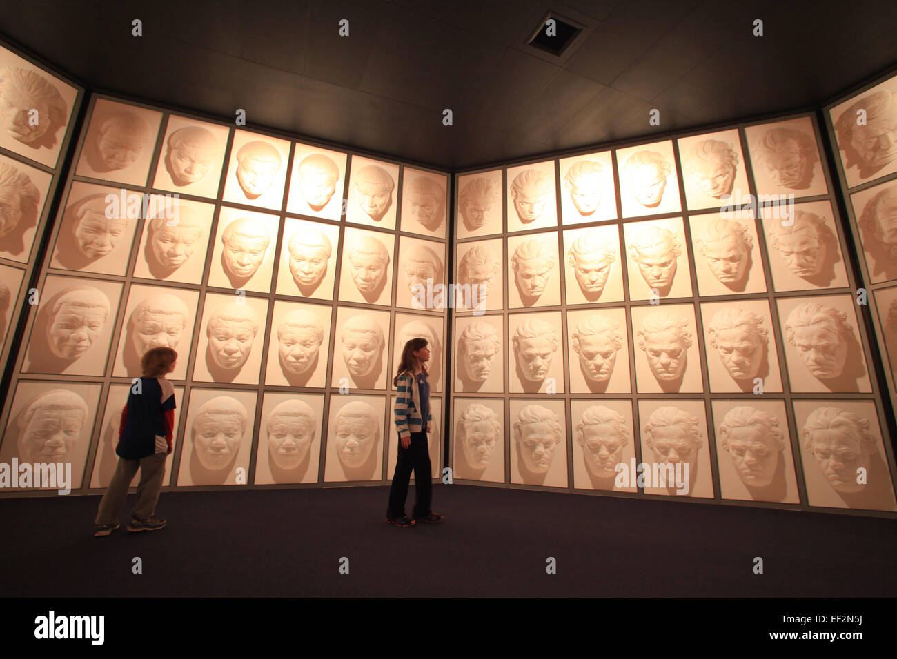 A room featuring 3D faces of famous people inside Puzzling World ...