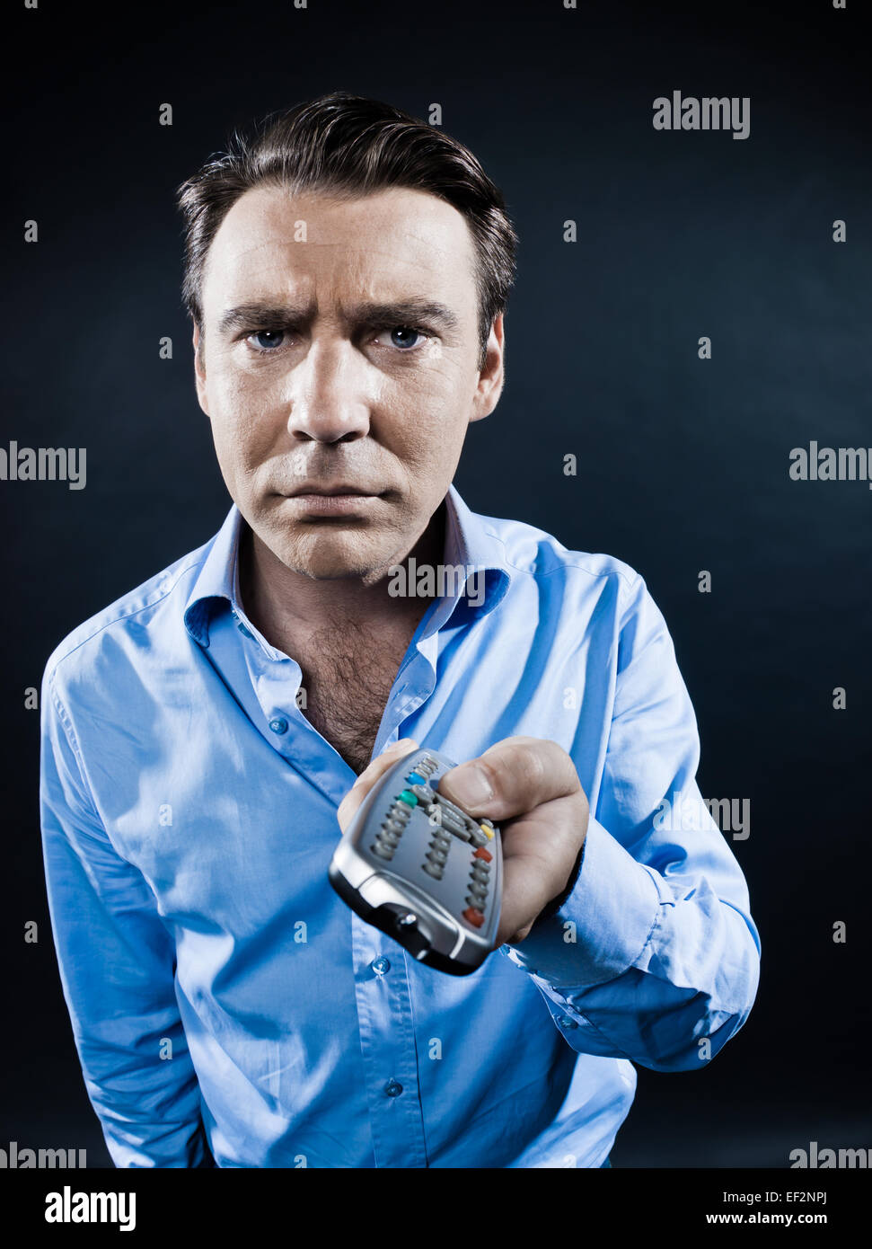 caucasian man portrait remote control fail isolated studio on black ...