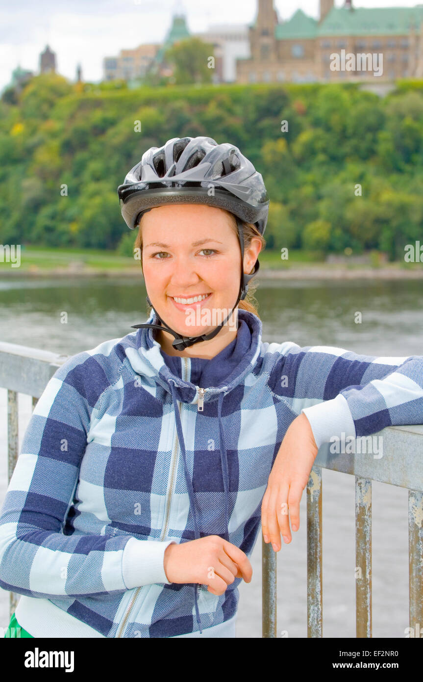 Woman leaning against railings hi-res stock photography and images - Alamy