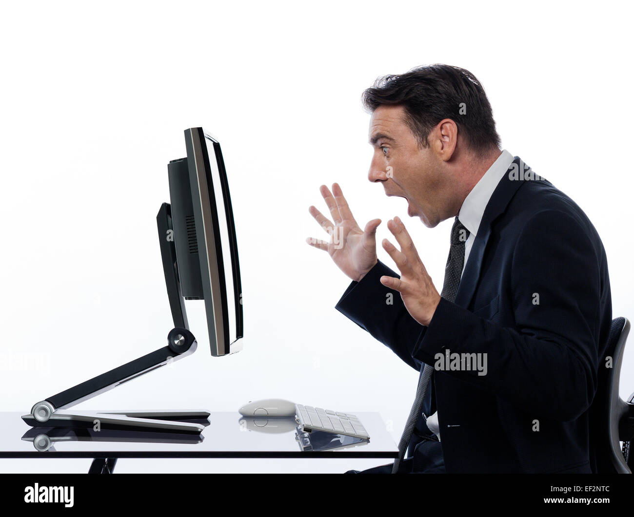 one caucasian business man computing and a computer display monitor on ...