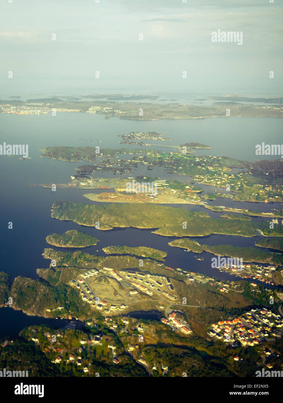Birds eye. View from window of plane airplane flying over fjords Norway ...